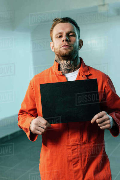 prisoner holding blackboard and looking at camera - Royalty-free Stock ...