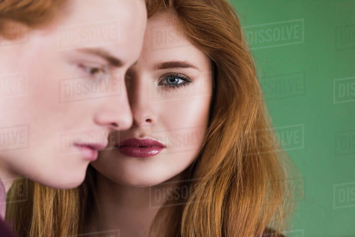 Side view of male fashion model and half face of young female - Royalty ...