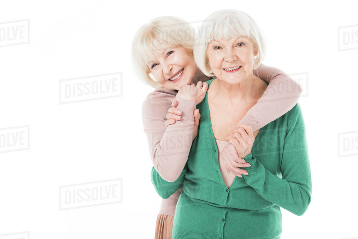 Two senior stylish women hugging isolated on white - Royalty-free Stock ...