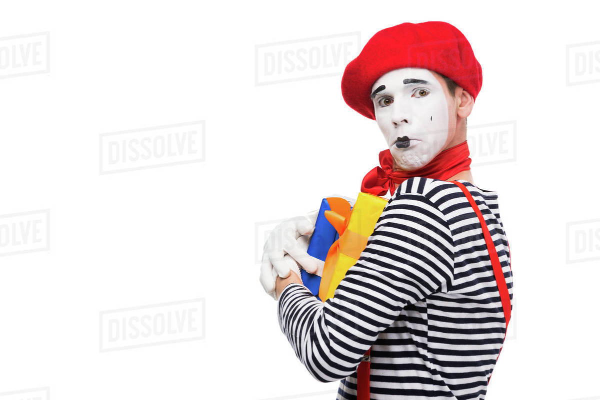 Upset mime holding gift boxes isolated on white - Royalty-free Stock ...
