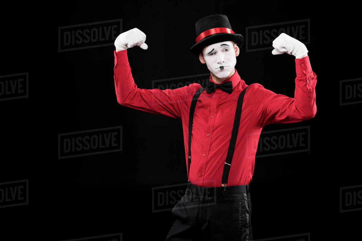 Mime showing muscles isolated on black - Royalty-free Stock Photo ...
