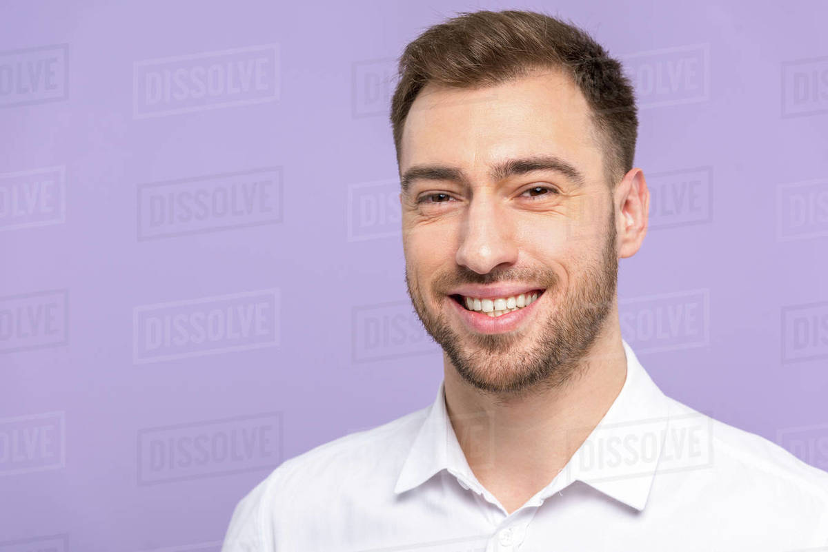 Handsome man smiling isolated on violet - Royalty-free Stock Photo ...
