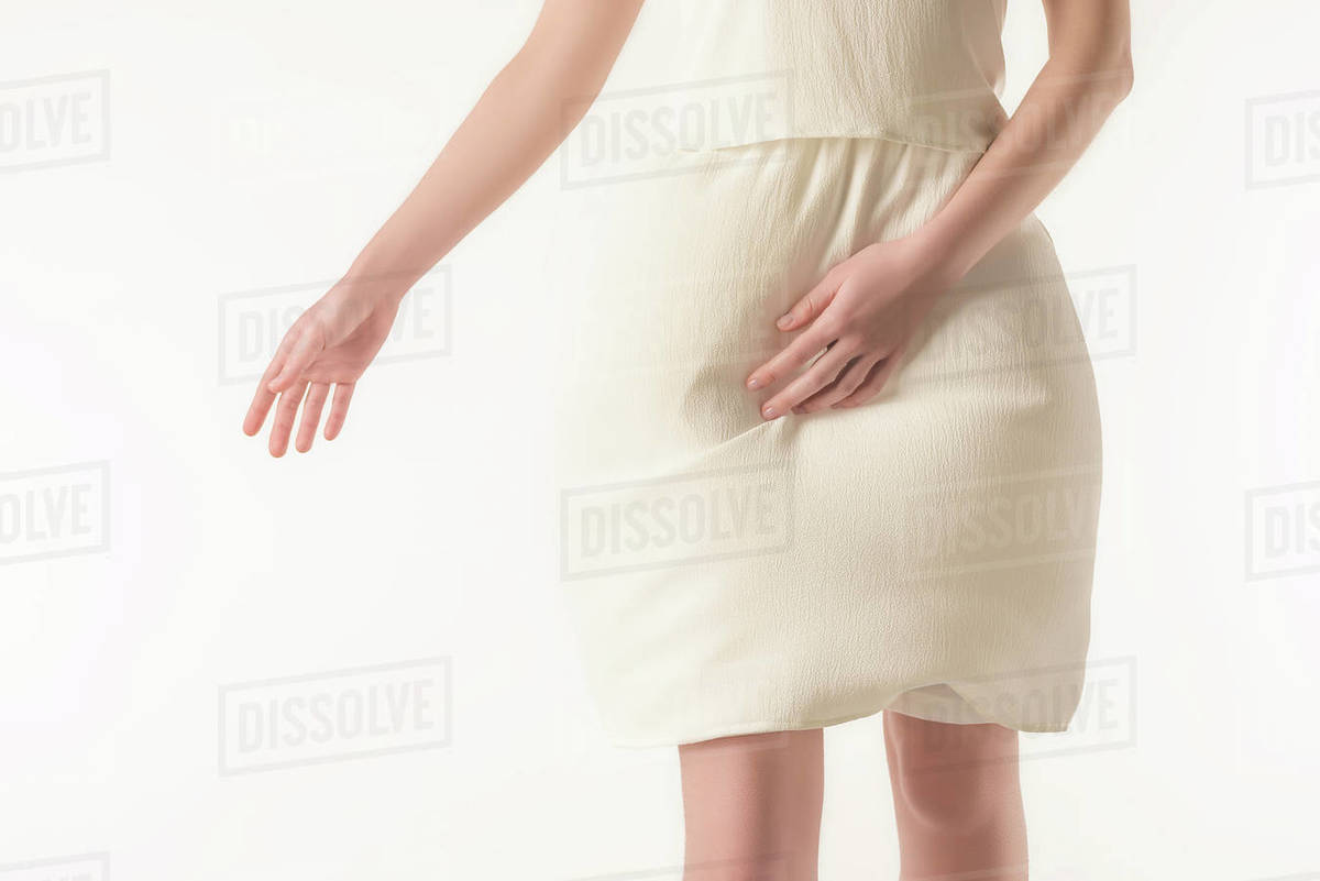 Partial view of girl in elegant white dress, isolated on white ...