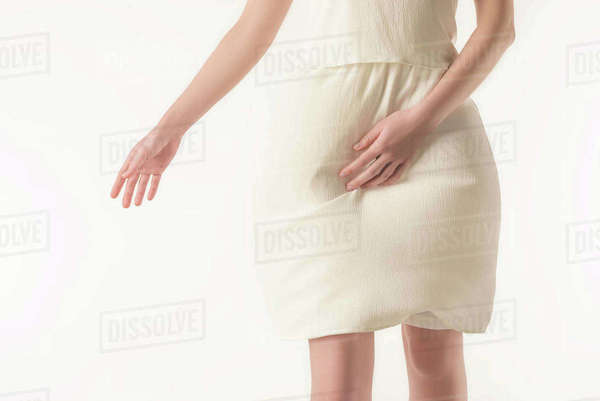 Partial view of girl in elegant white dress, isolated on white ...