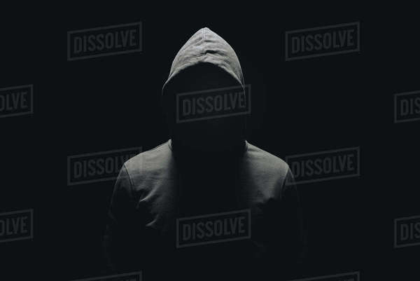 faceless man in hoodie standing isolated on black - Royalty-free Stock ...