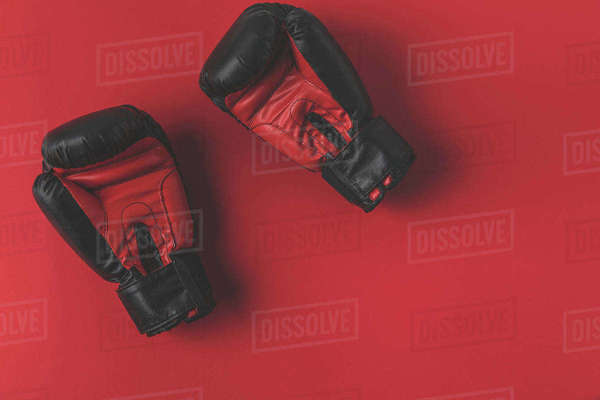 top view of boxing gloves lying on red tabletop - Royalty-free Stock ...