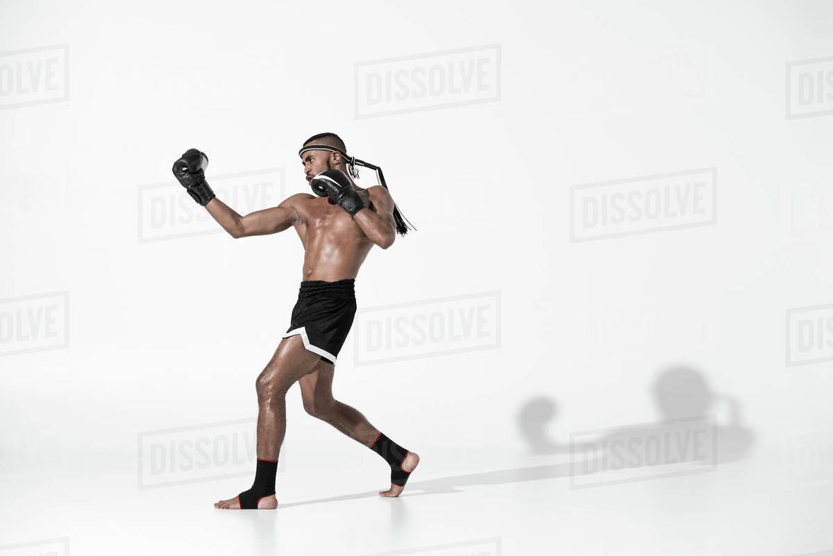 side view of muay thai fighter training isolated on white, fight club ...