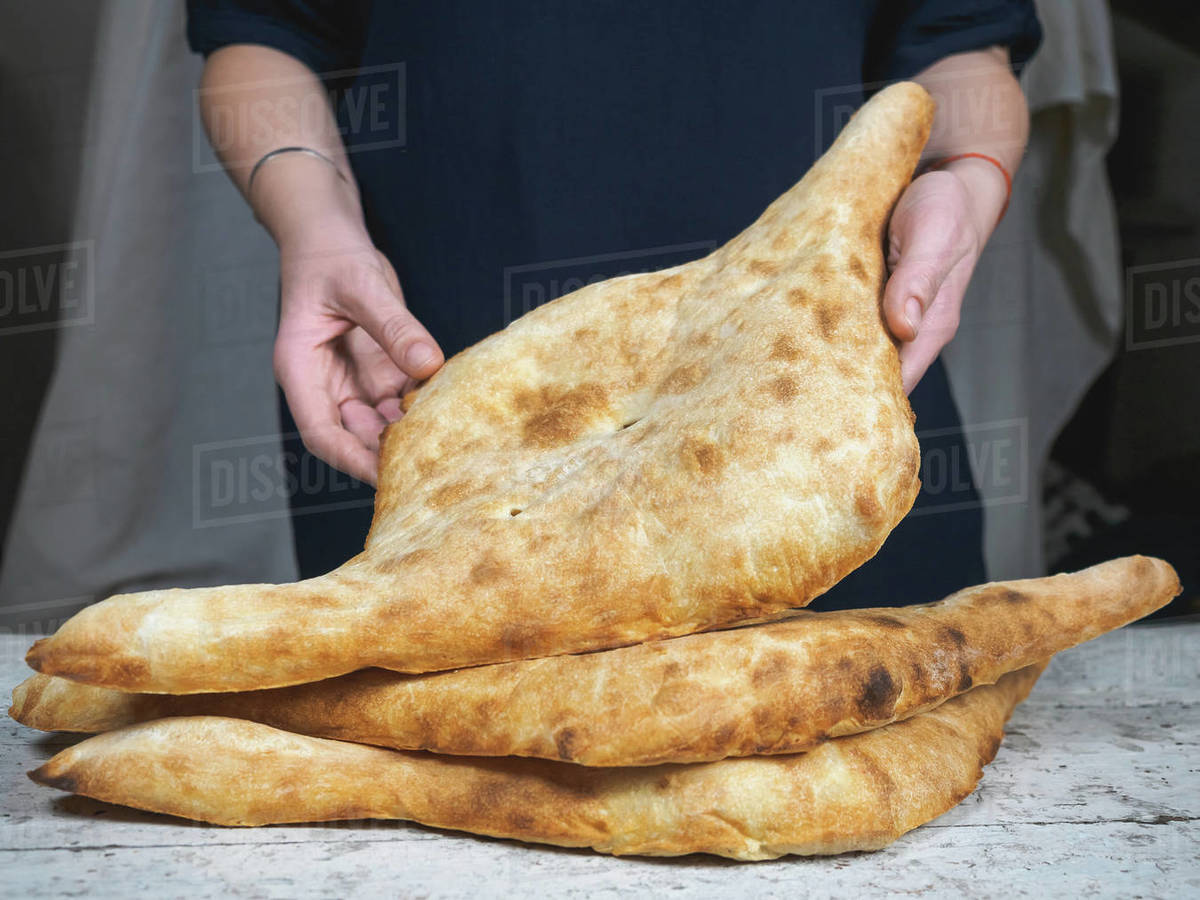Mid section of person holding delicious traditional Georgian lavash ...