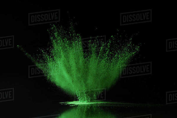 Green holi powder explosion on black, Hindu spring festival - Royalty ...