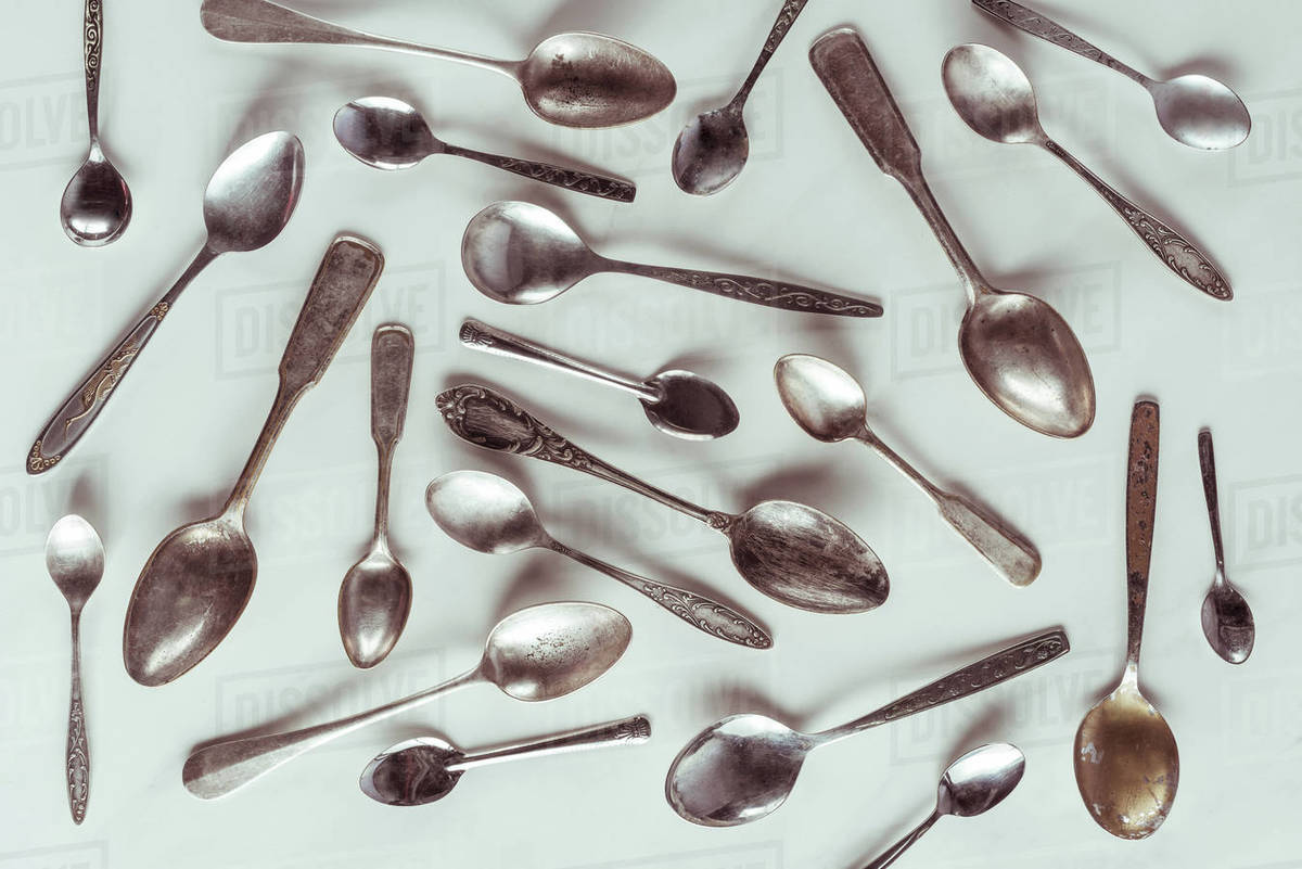 Vintage metal spoons on white background - Royalty-free Stock Photo ...