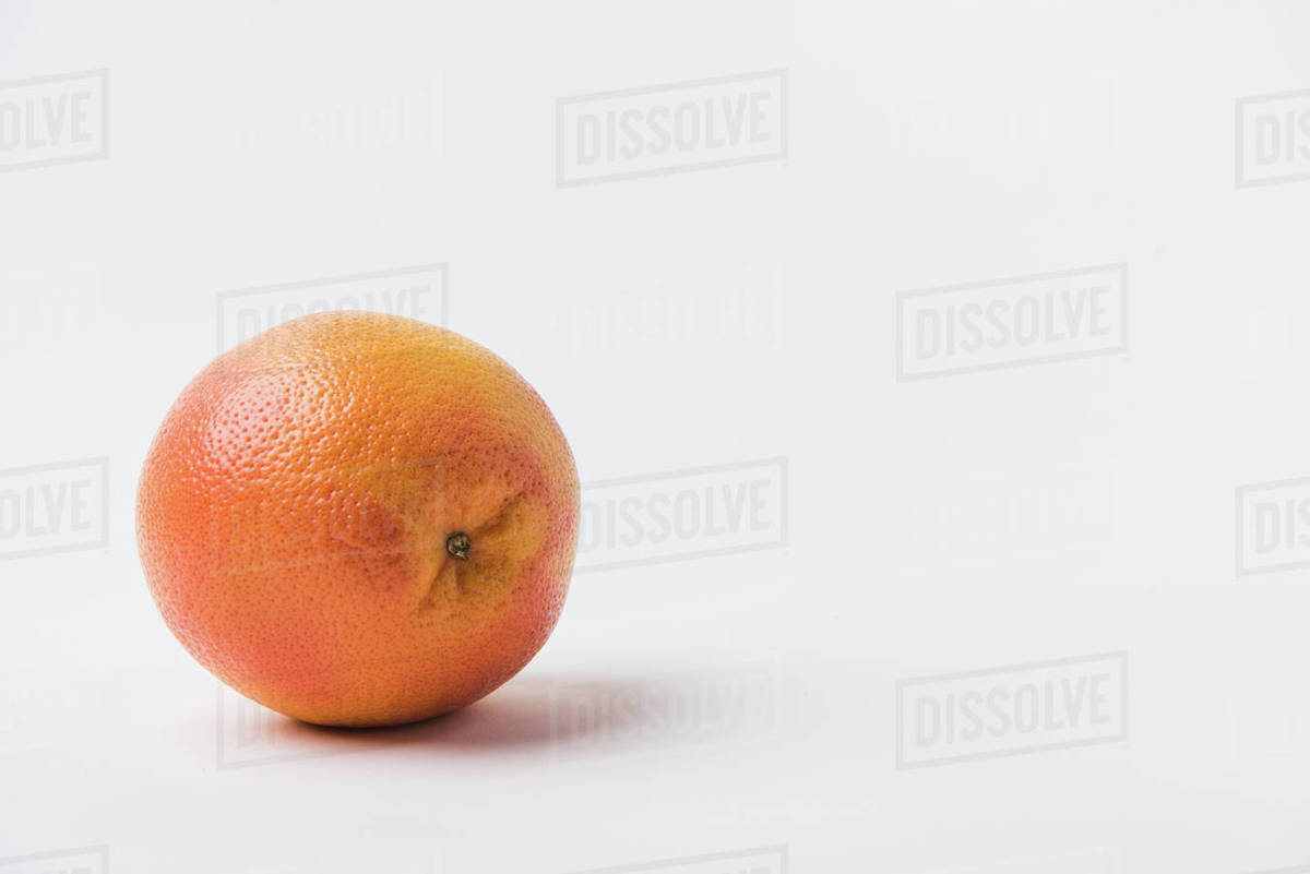 Raw unpeeled orange laying on white background - Royalty-free Stock ...