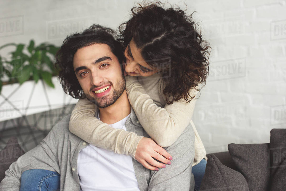 Smiling affectionate couple hugging at home - Royalty-free Stock Photo ...