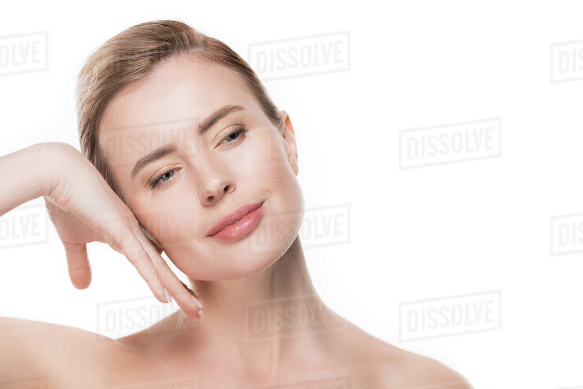 Female with clean skin touching own face isolated on white - Royalty ...