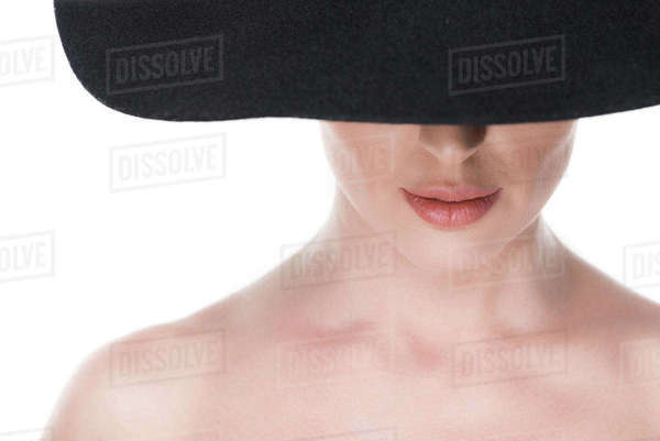Woman with partly hidden face under hat isolated on white - Stock Photo ...