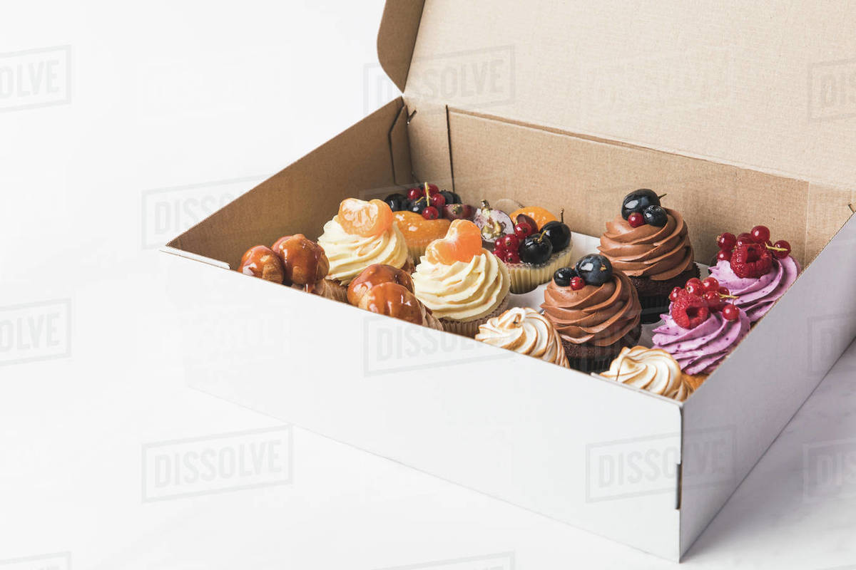 Top view of sweet cupcakes in cardboard box - Royalty-free Stock Photo ...