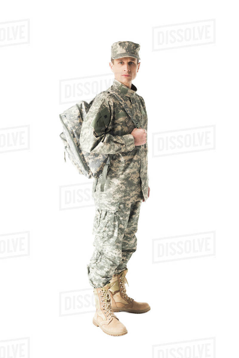Handsome army soldier in uniform holding backpack isolated on white ...