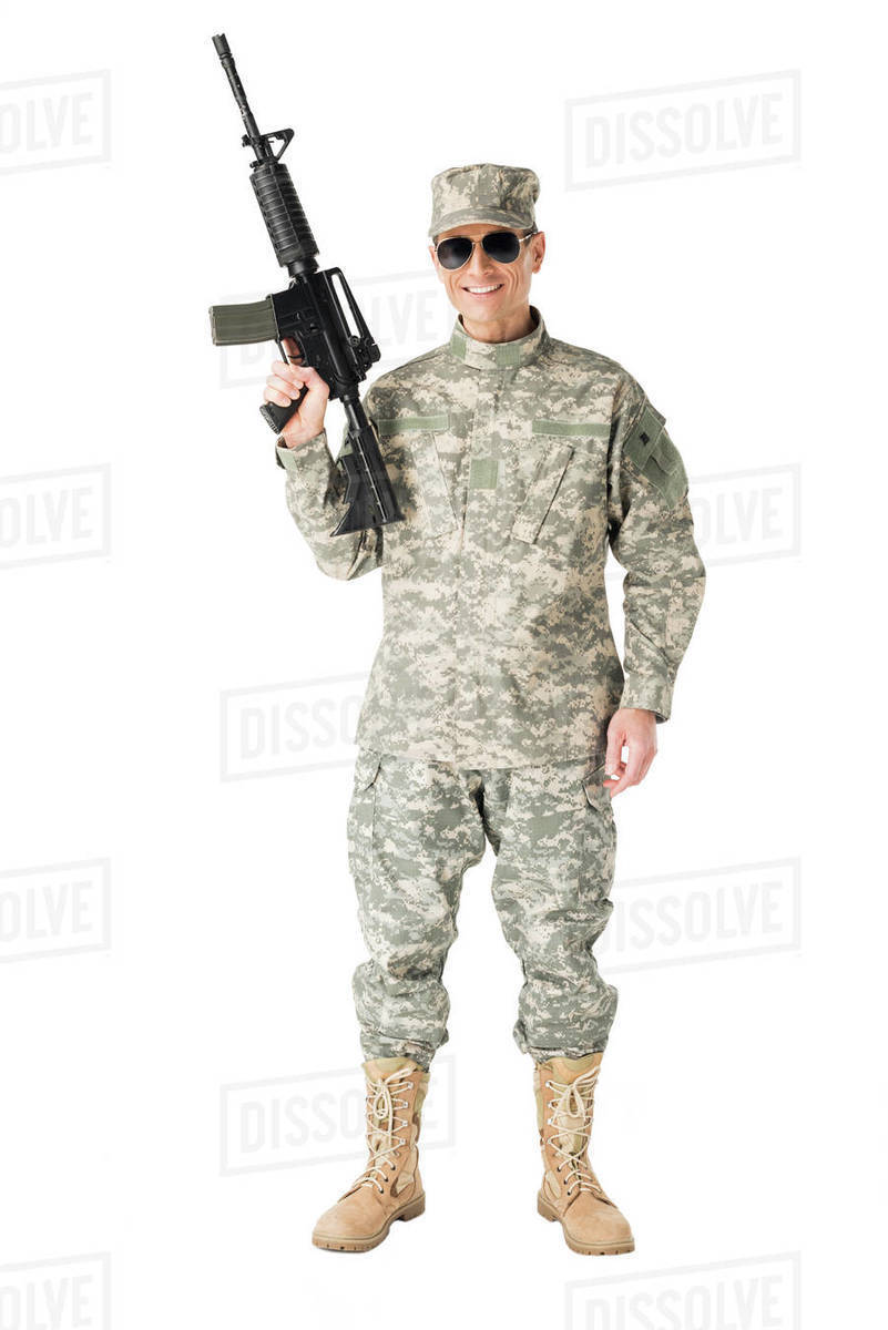 Army soldier wearing uniform and holding gun isolated on white ...