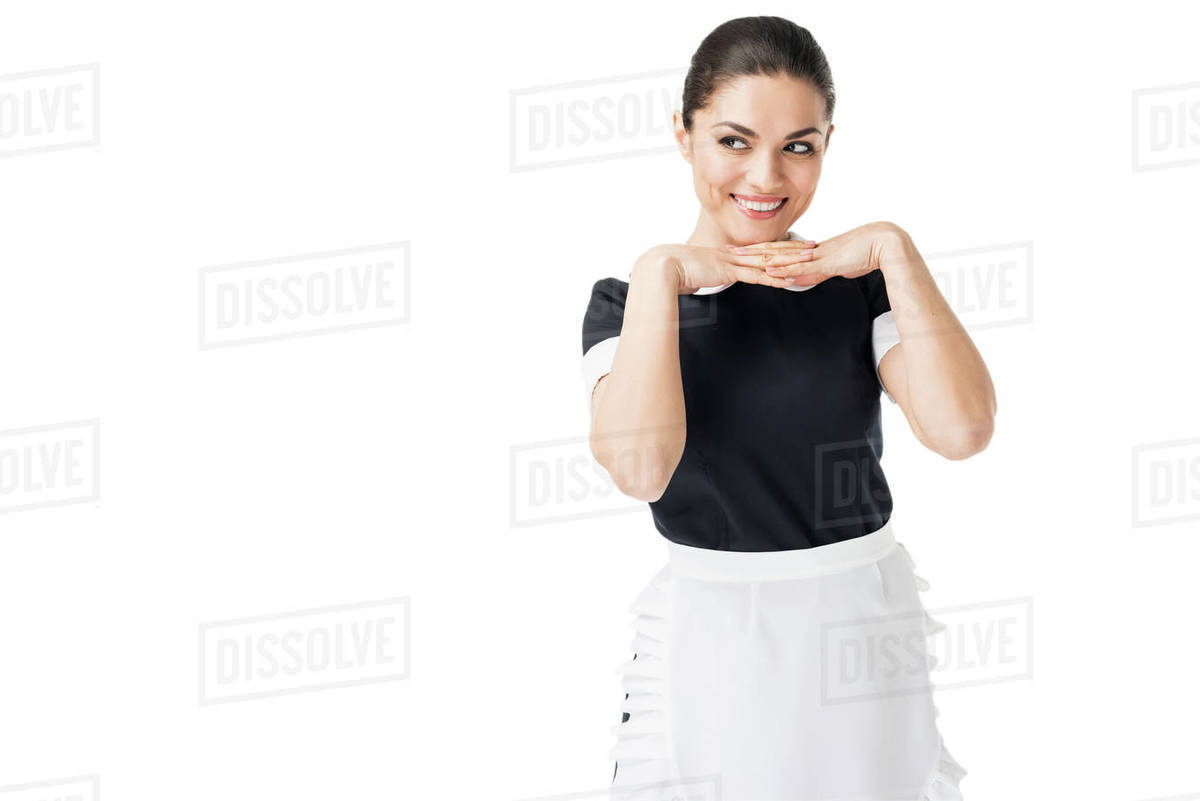 Smiling maid in professional uniform with hands by face isolated on ...