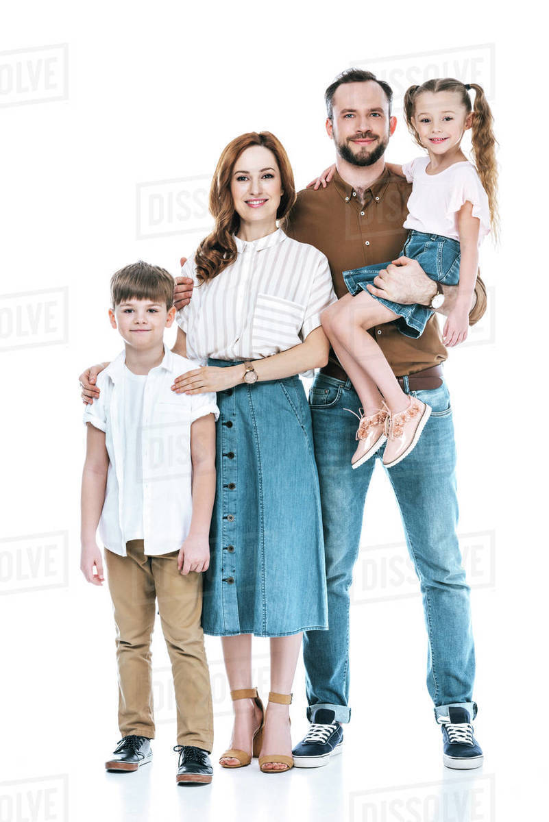 Full length view of happy family with two children standing together ...