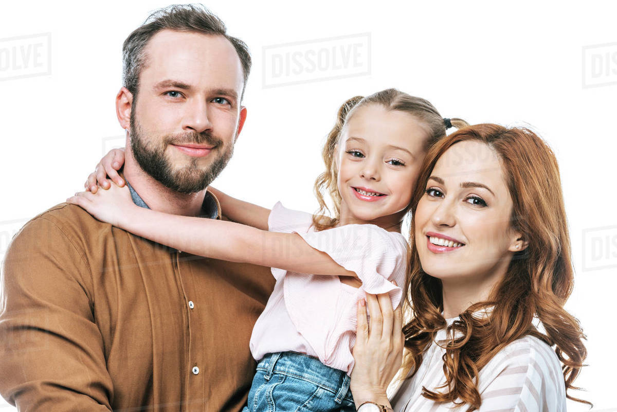 Happy family with one child smiling at camera isolated on white ...