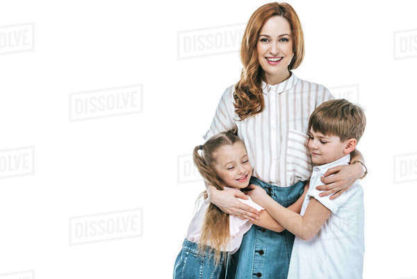 Happy mother hugging adorable little kids isolated on white - Royalty ...
