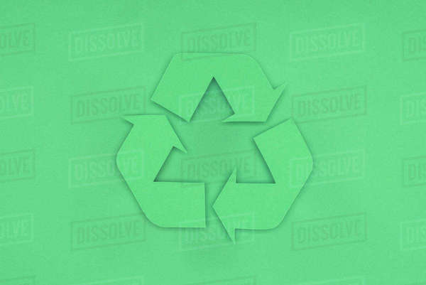 Top view of green trash recycle sign with arrows - Stock Photo - Dissolve