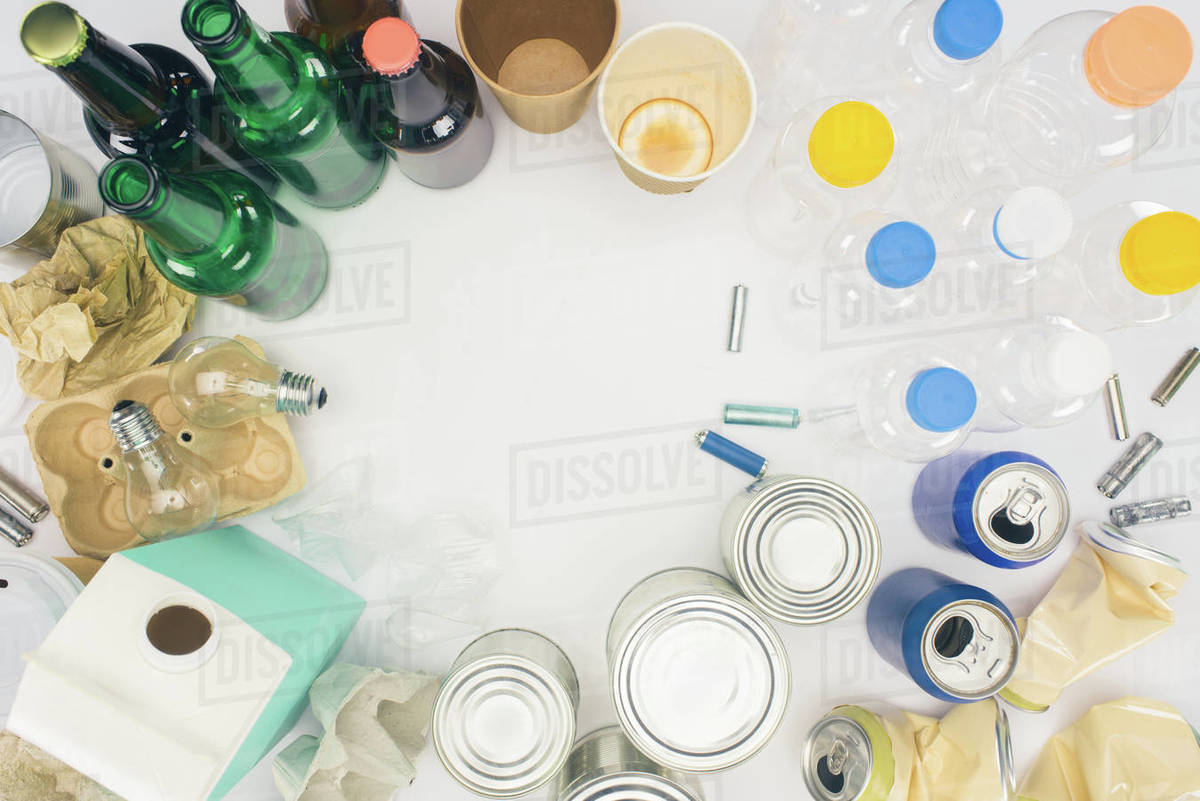 Top view of round frame of different types of trash on white - Royalty ...