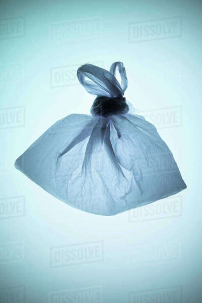 Tied transparent plastic bag under blue toned light - Stock Photo ...