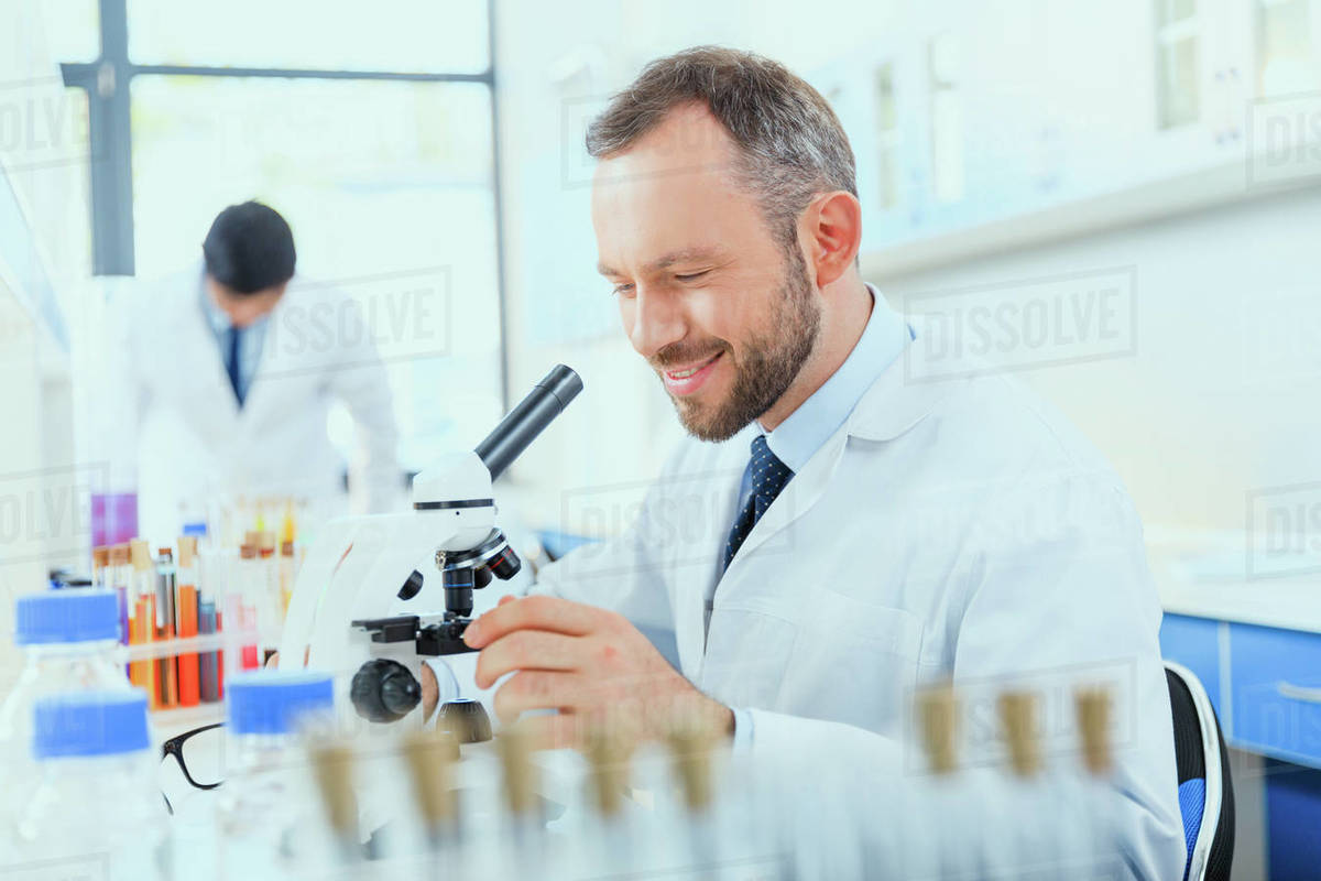 Young doctors in uniform working at testing laboratory, laboratory ...