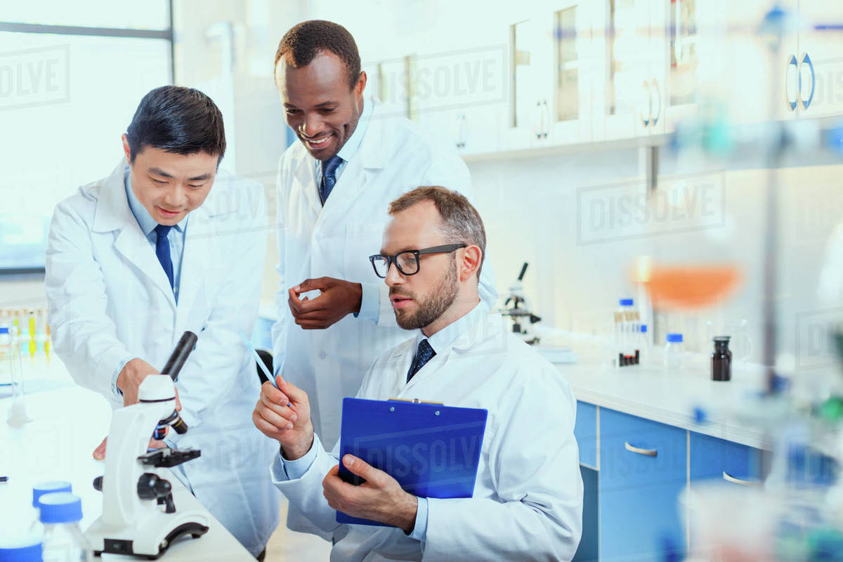 Young doctors in uniform working at testing laboratory, laboratory ...