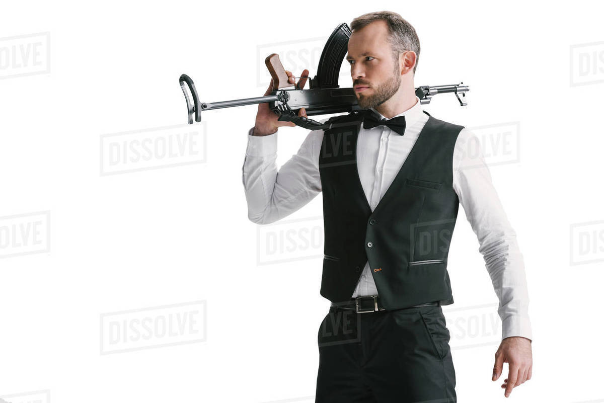 Secret agent in suit with rifle on shoulder isolated on white - Royalty ...