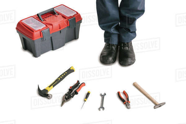 Cropped shot of construction worker with tools isolated on white ...