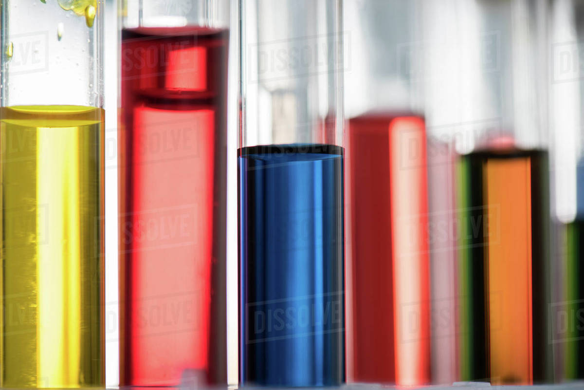 Close-up view of test tubes with colorful chemical samples in lab ...