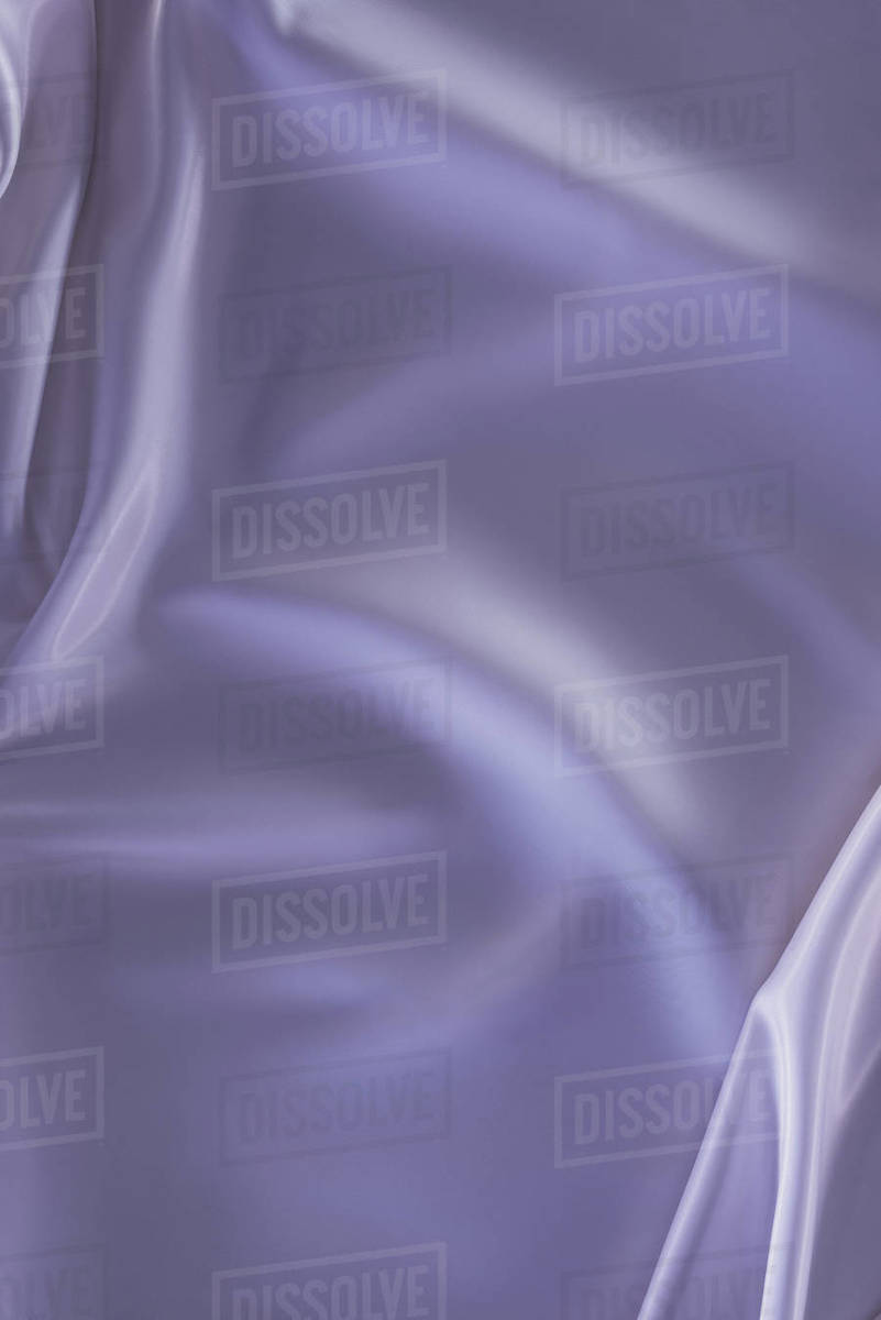 Violet shiny silk fabric background - Stock Photo - Dissolve