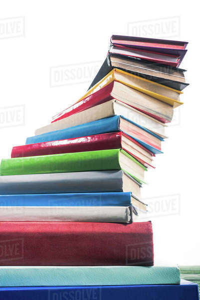 Spiral tower of colorful stacked books - Stock Photo - Dissolve