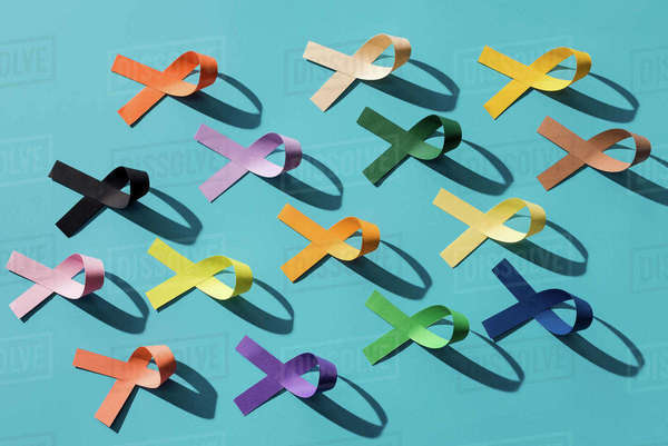 Flat lay with arranged colorful ribbons isolated on blue, world health ...