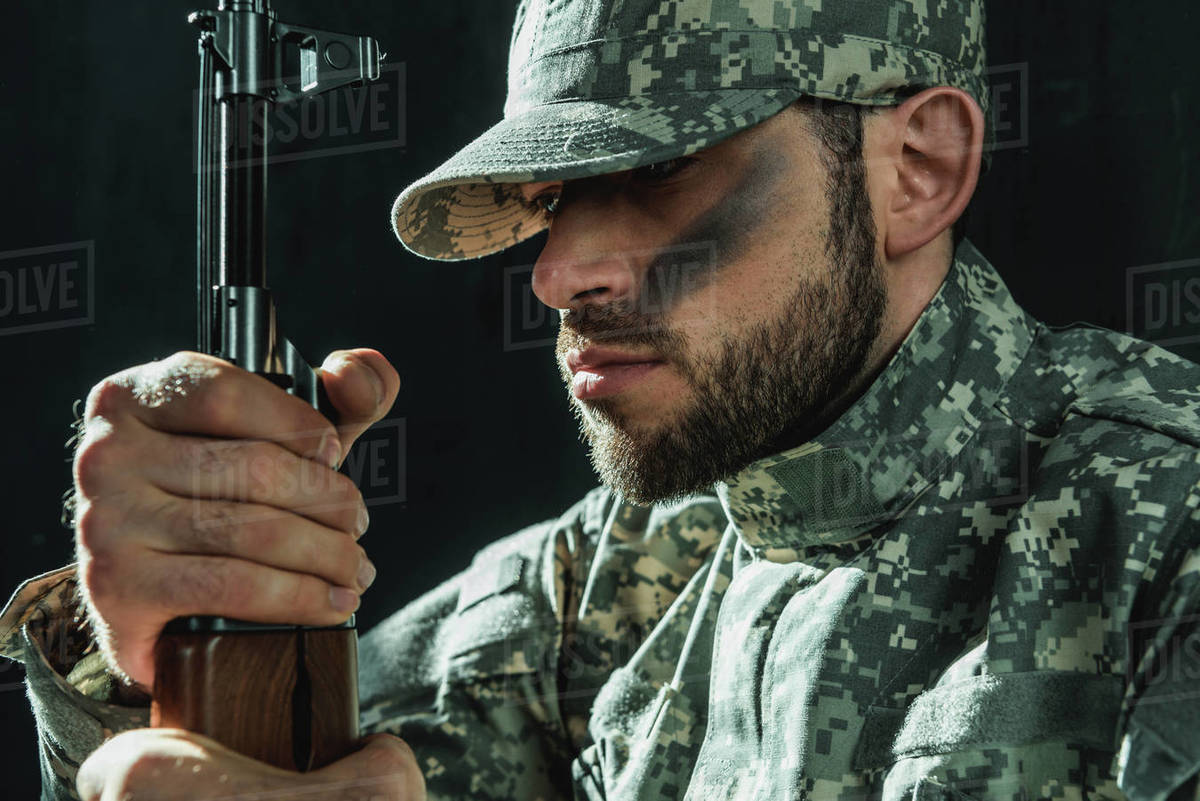 close-up shot of soldier in military uniform with rifle isolated on ...