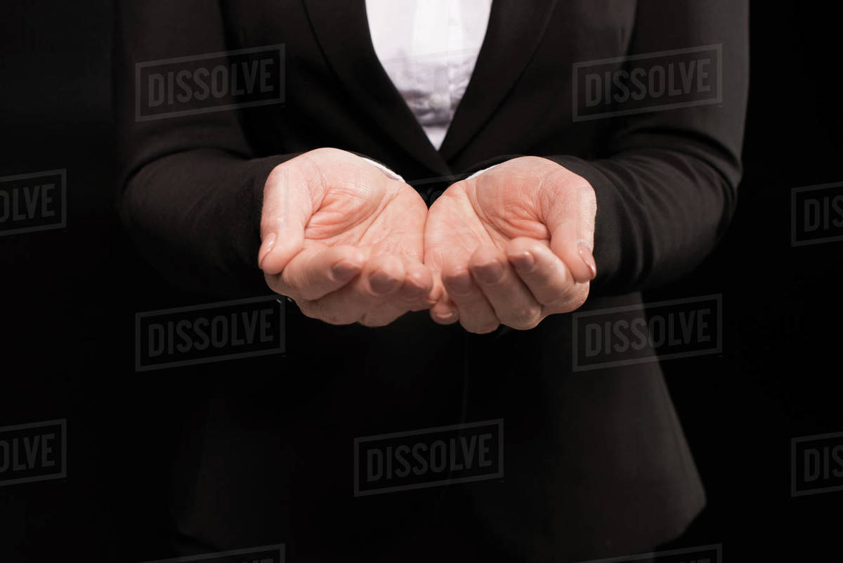 Cropped shot of female hands cupped together in an asking gesture ...