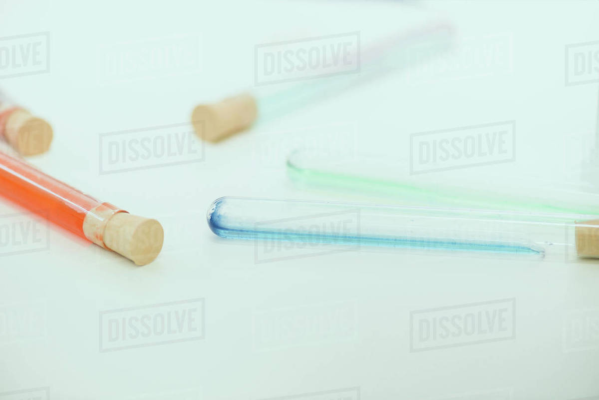 Close up view of different tubes with reagents isolated on grey ...
