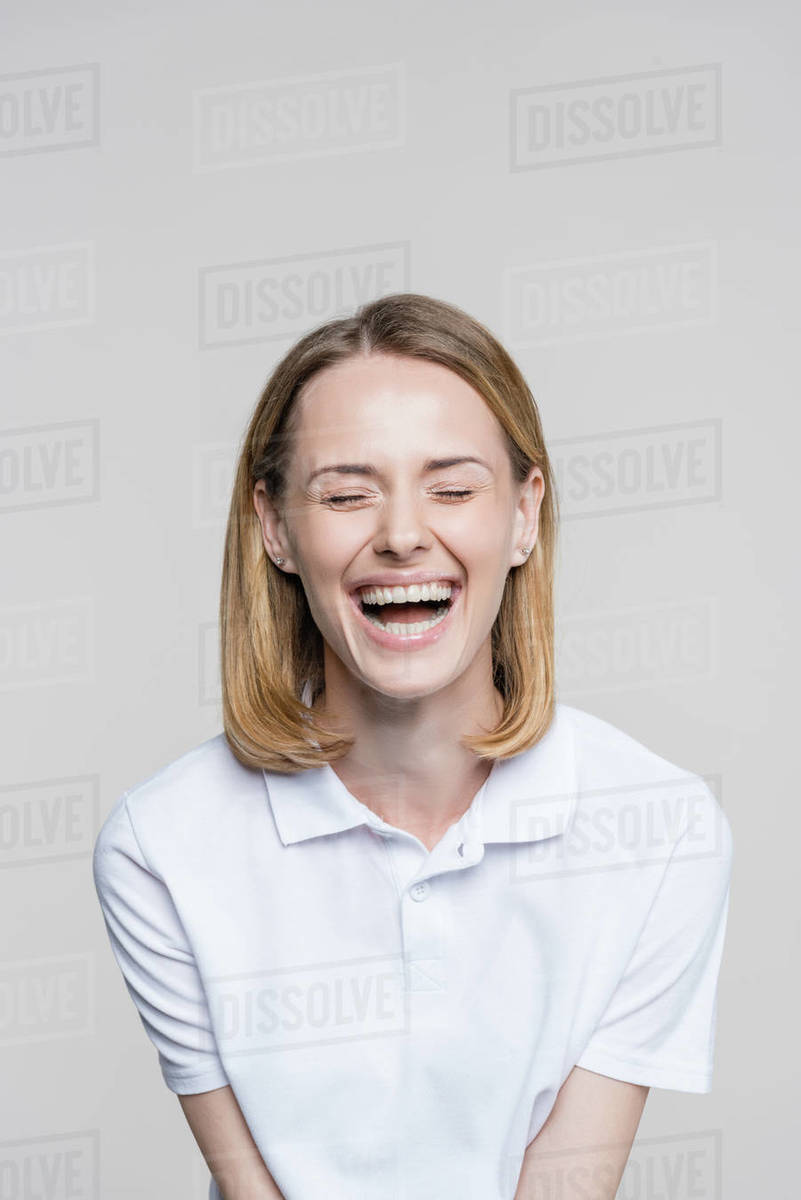 Portrait of beautiful laughing woman, isolated on grey - Royalty-free ...