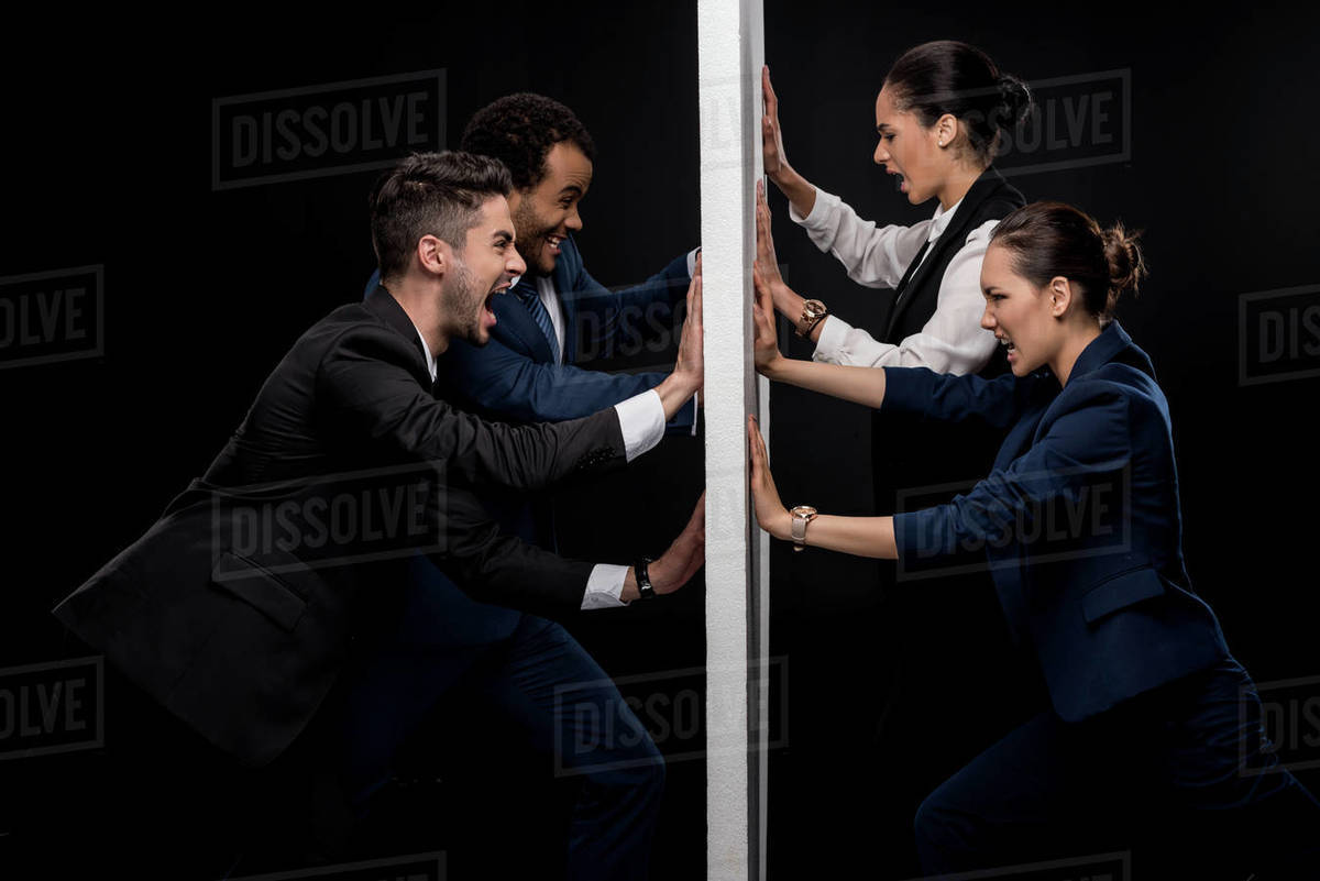 Group of angry businessmen ready to fight with businesswomen from ...