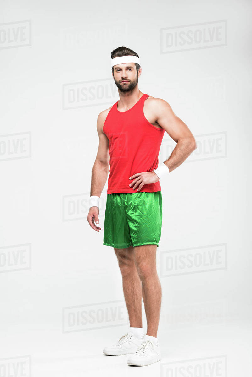 Caucasian sportsman posing in retro sportswear, isolated on white ...