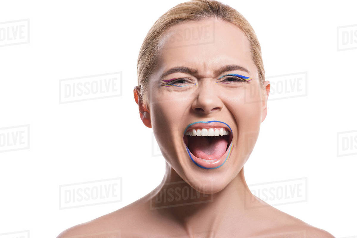 Angry woman with colored makeup with lines screaming isolated on white ...