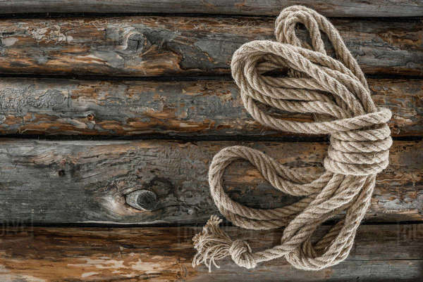Top view of tied nautical rope on grunge wooden surface - Royalty-free ...