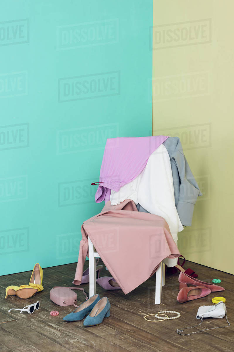 messy room with elegant clothes and shoes on chair - Royalty-free Stock ...