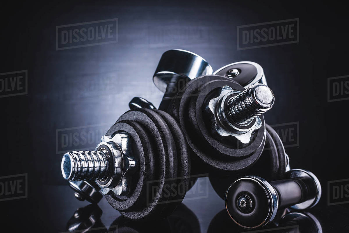 Close-up view of various dumbbells, sport and healthy lifestyle concept ...