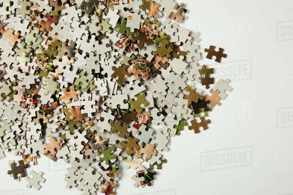 Top view of jigsaw puzzle pieces with copy space on grey - Royalty-free ...