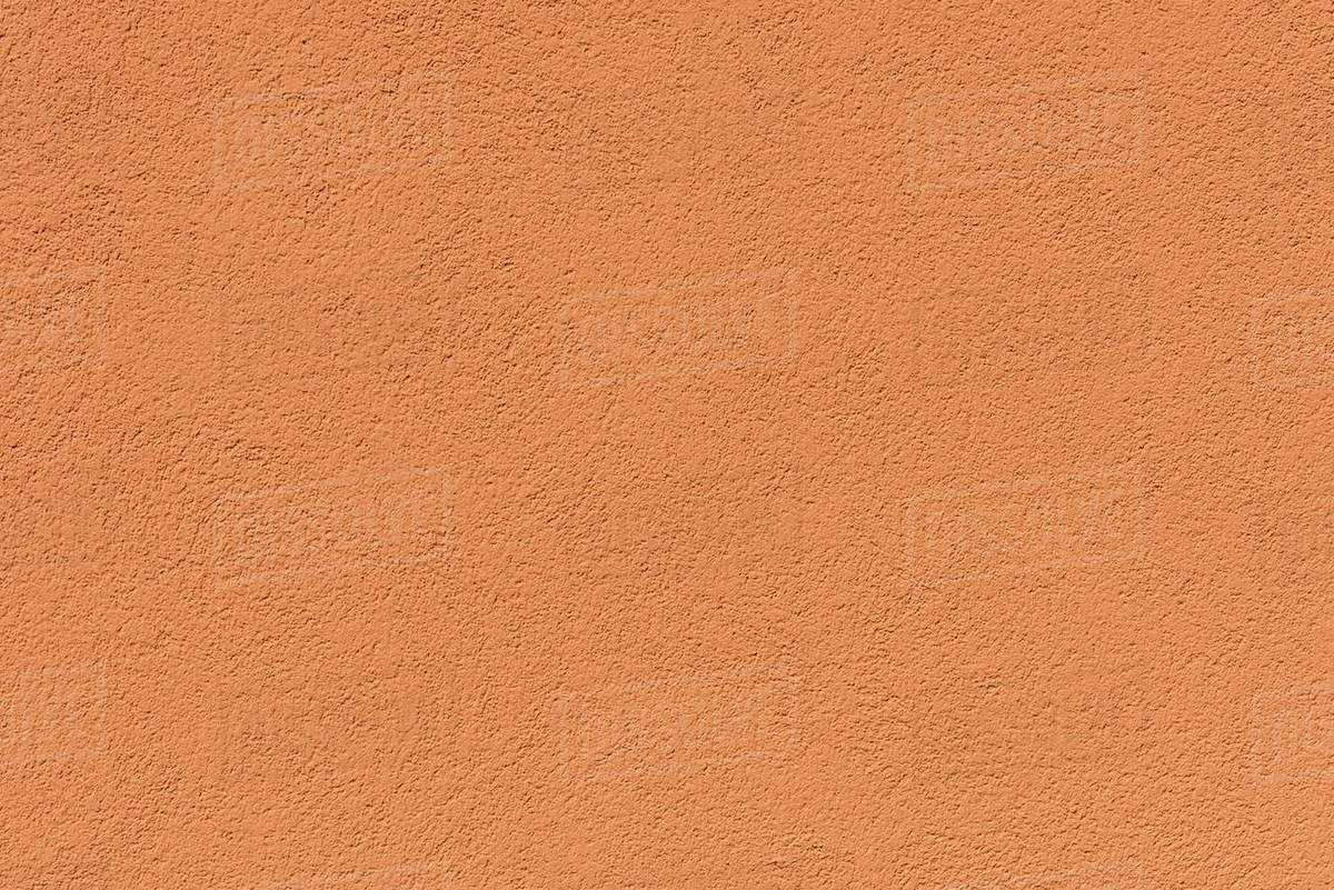 Close-up view of orange rough weathered background - Stock Photo - Dissolve