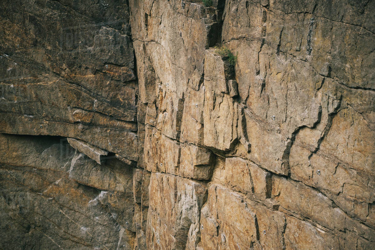 Full frame image of rocky cliff surface background - Stock Photo - Dissolve
