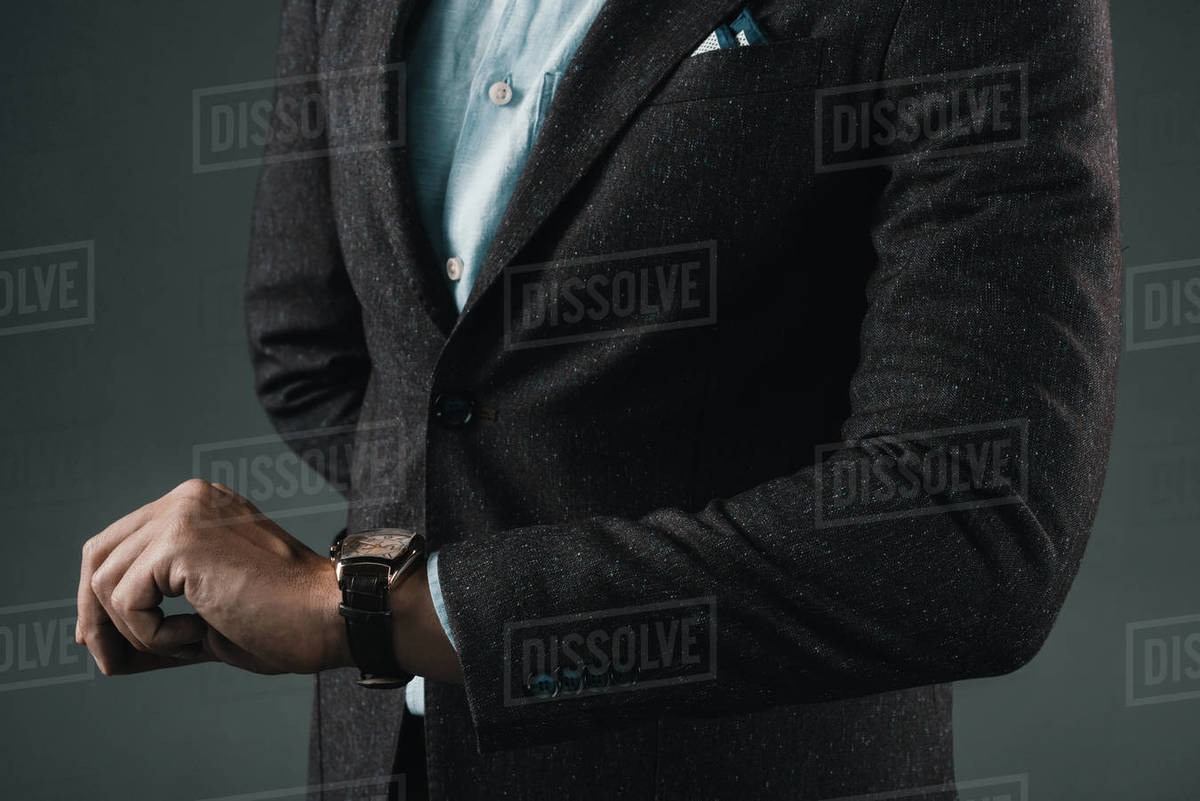 Cropped shot of stylish man looking at hand watches - Royalty-free ...